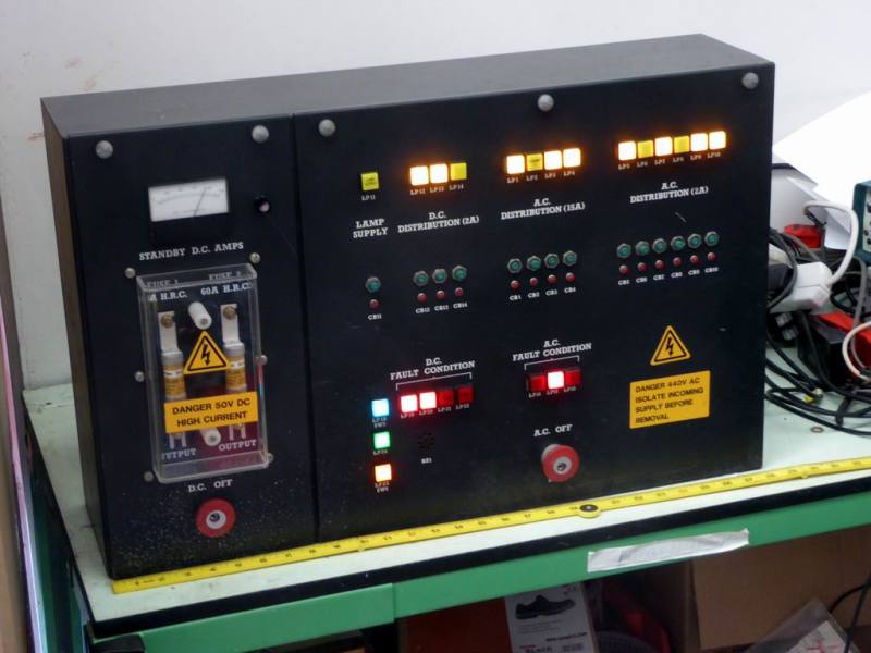 Practical large black electrical control box with coloured square lamps ...