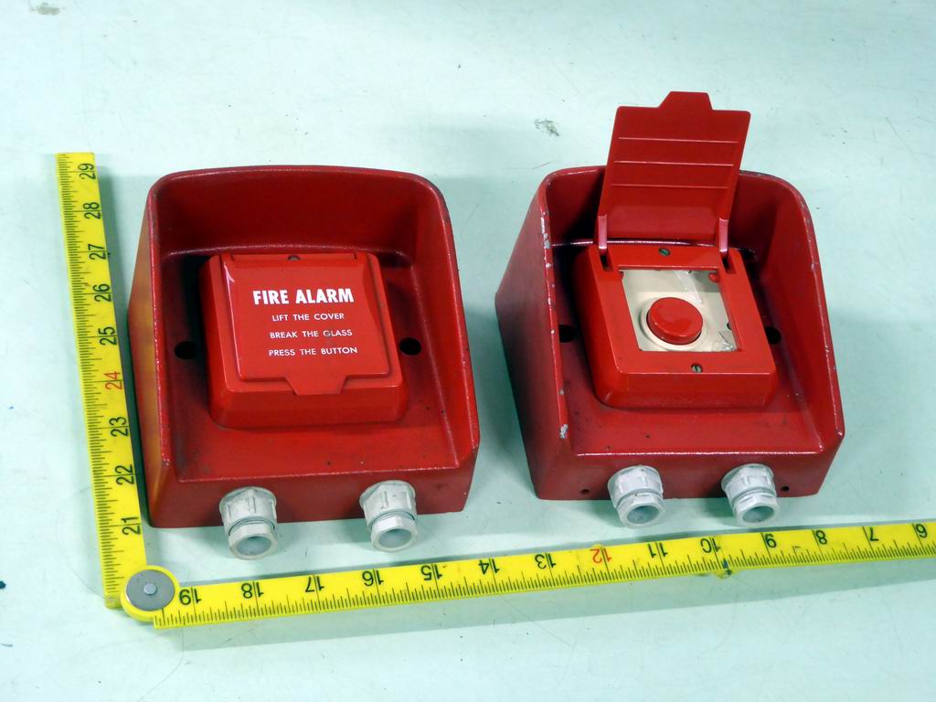 Red fire alarm manual activation switches with flip up covers | Electro ...