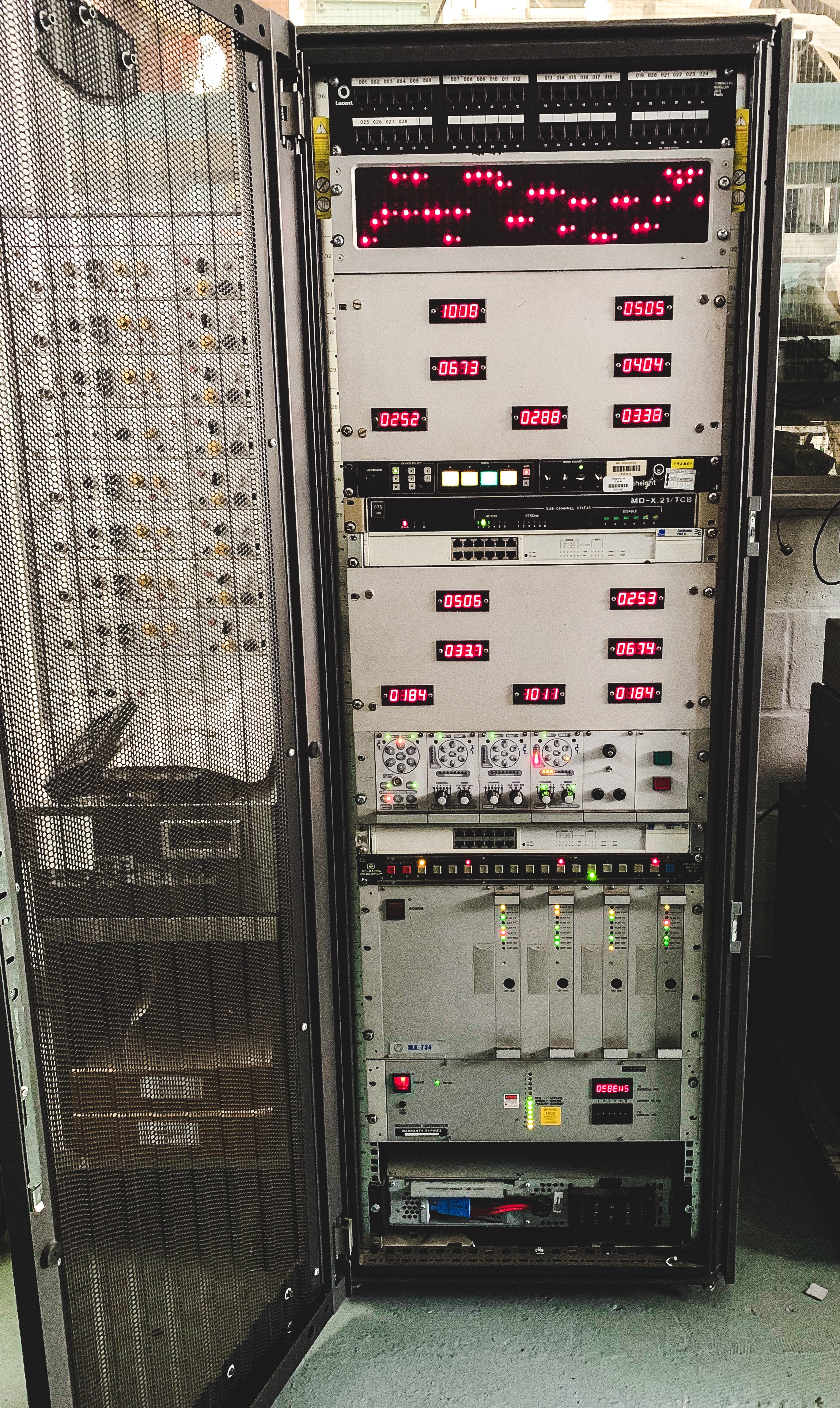 Modern looking server rack with mesh front door | Electro Props Hire