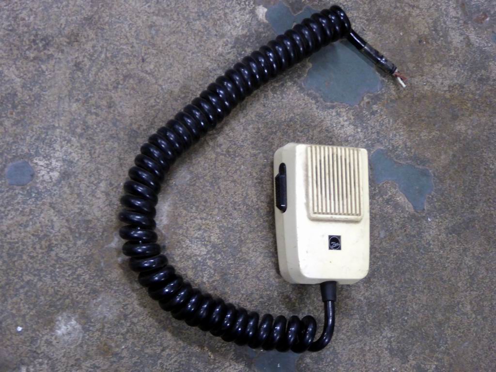 Period beige fist microphone with black curly lead | Electro Props Hire