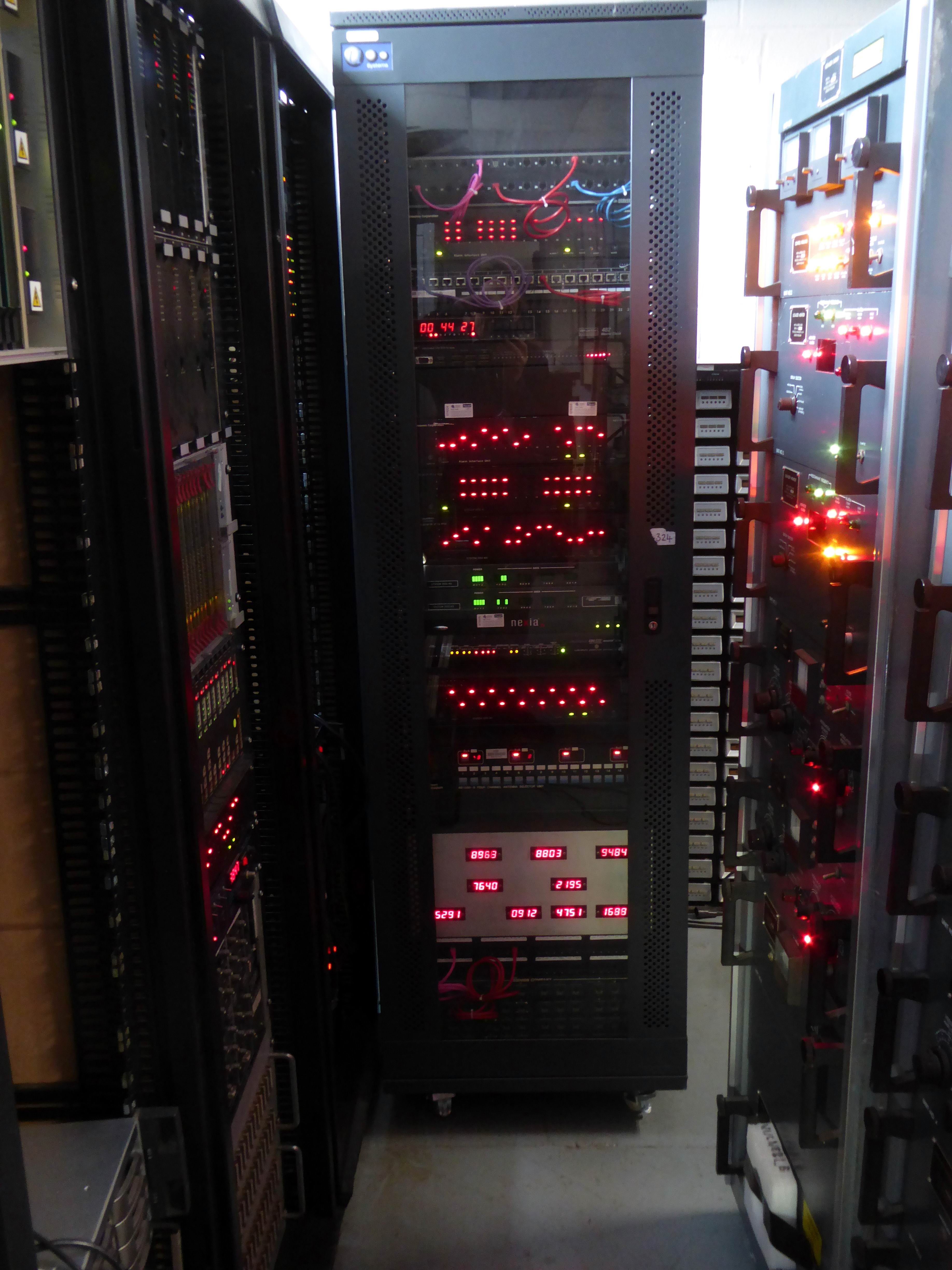 Tall black practical server rack with smoked glass front. | Electro ...