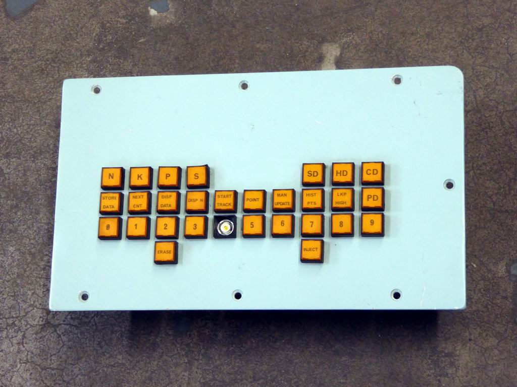 Practical British navy control panel with illuminated orange square ...