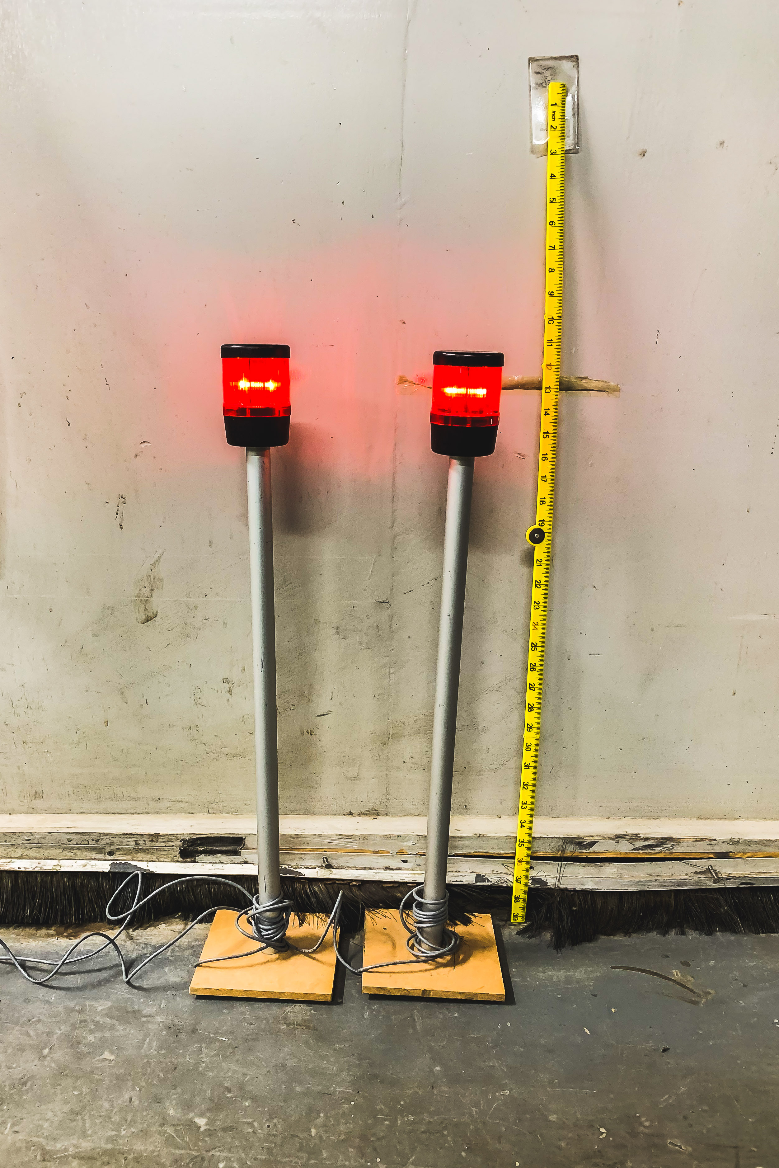 Red beacon lights on poles (static) | Electro Props Hire
