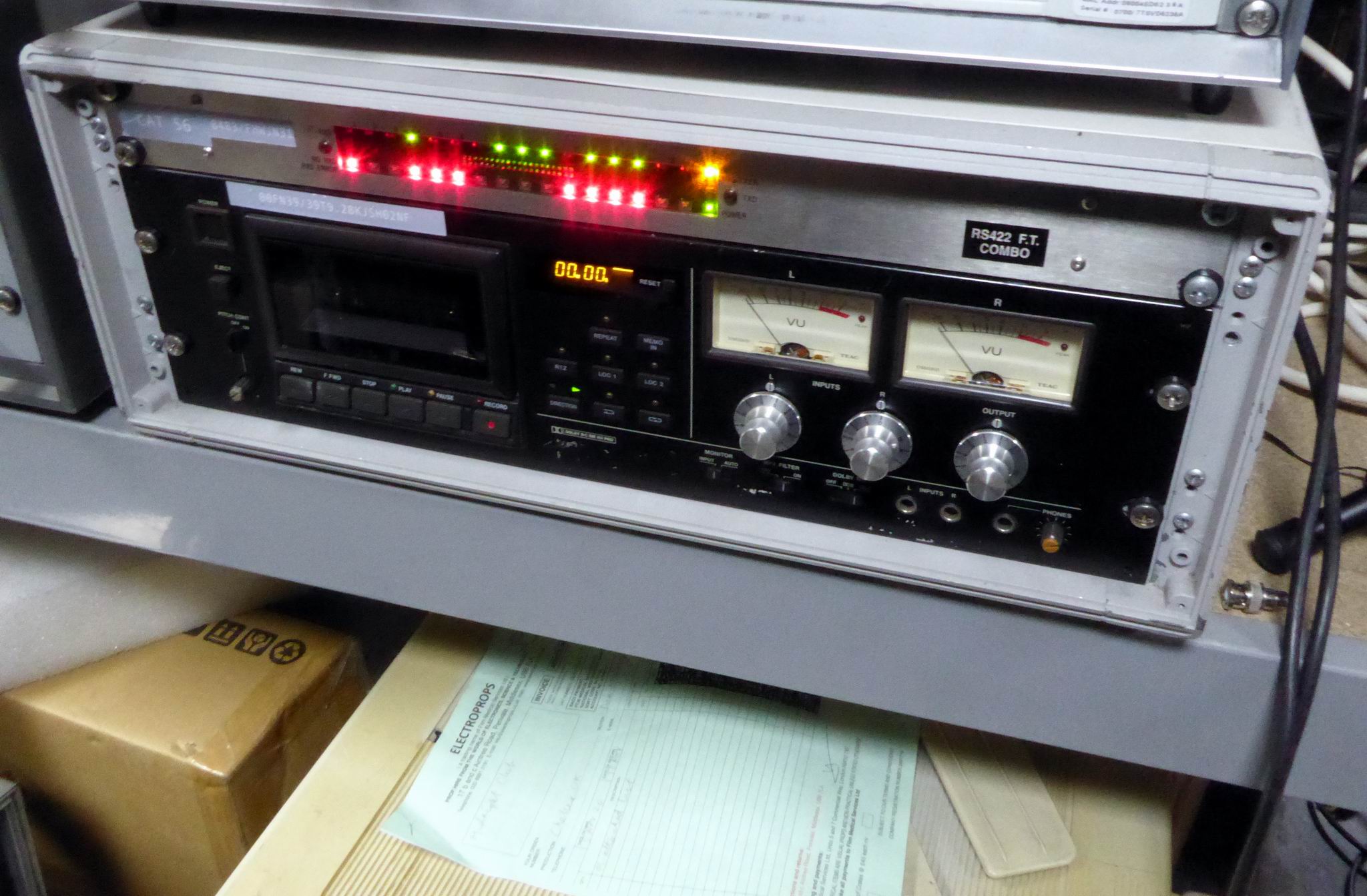 Practical black audio cassette tape deck in low desk top cabinet ...