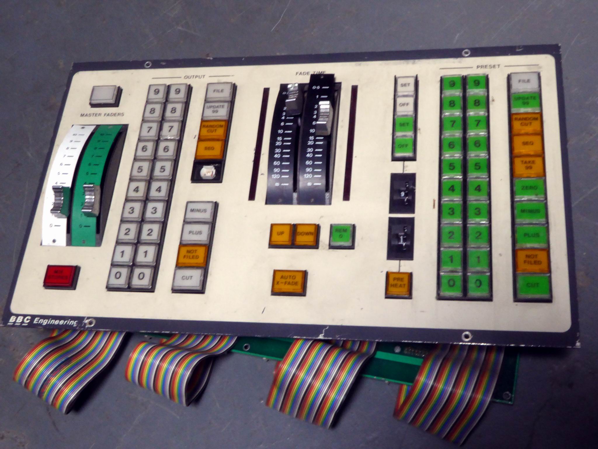 Audio studio panel with linear faders & coloured square buttons ...