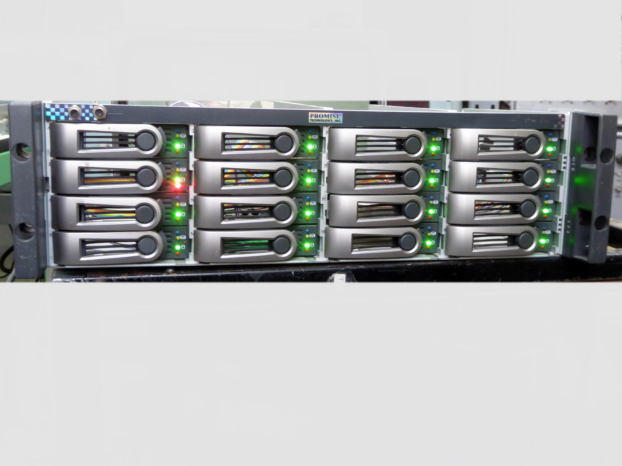 Practical hitech server disk array panel with multiple coloured winking ...
