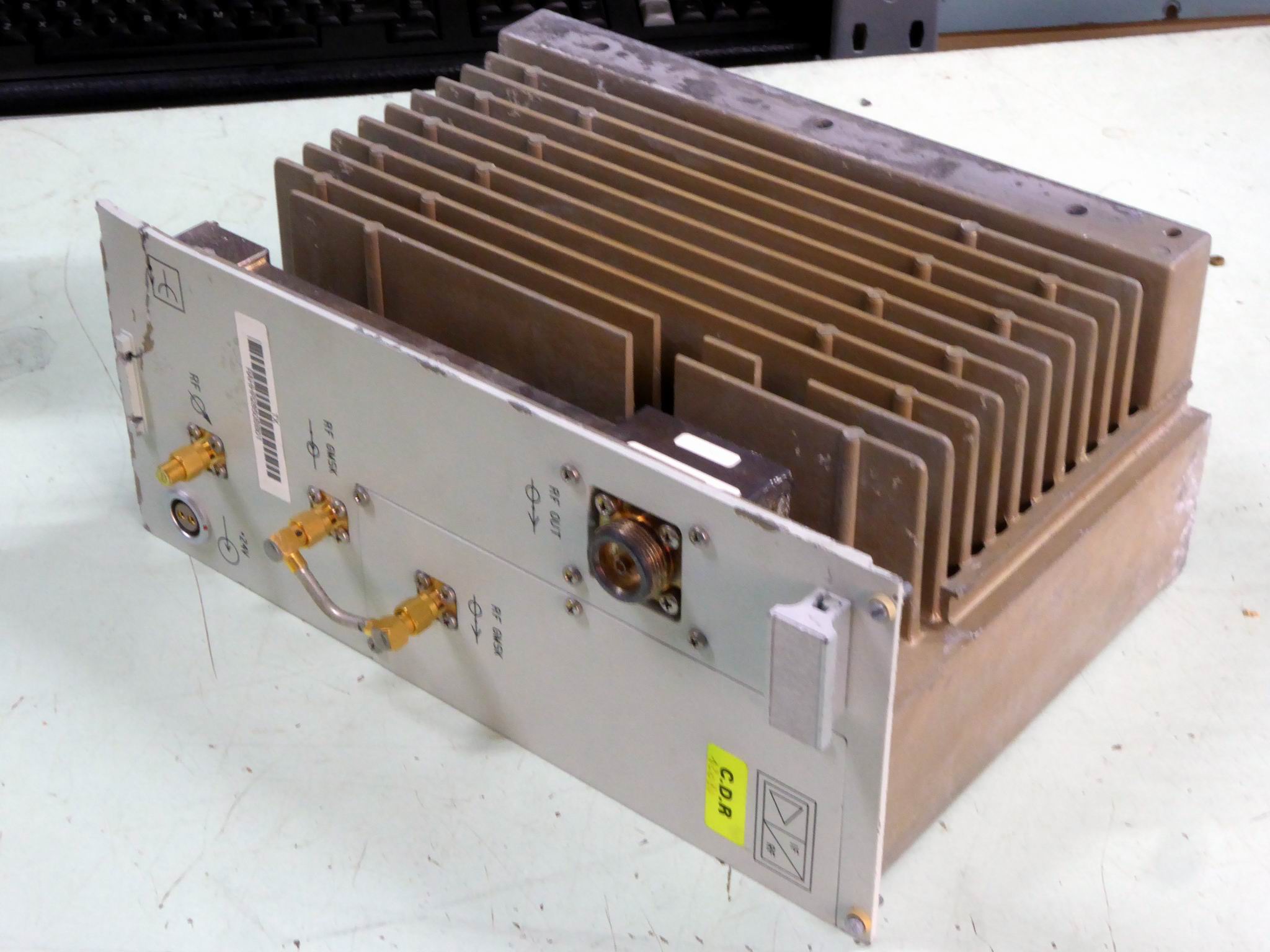 Technical looking electronics module with gold connectors & finned ...