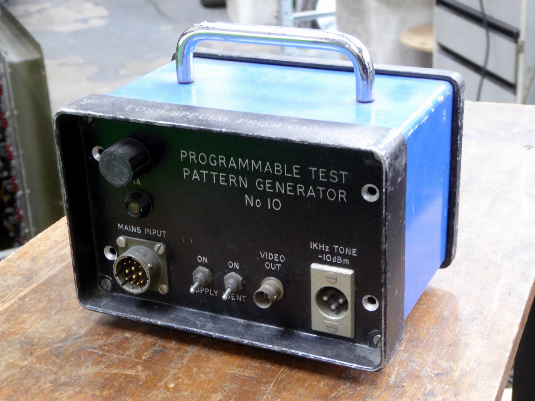 Programmable test pattern generator in black & blue case with ...