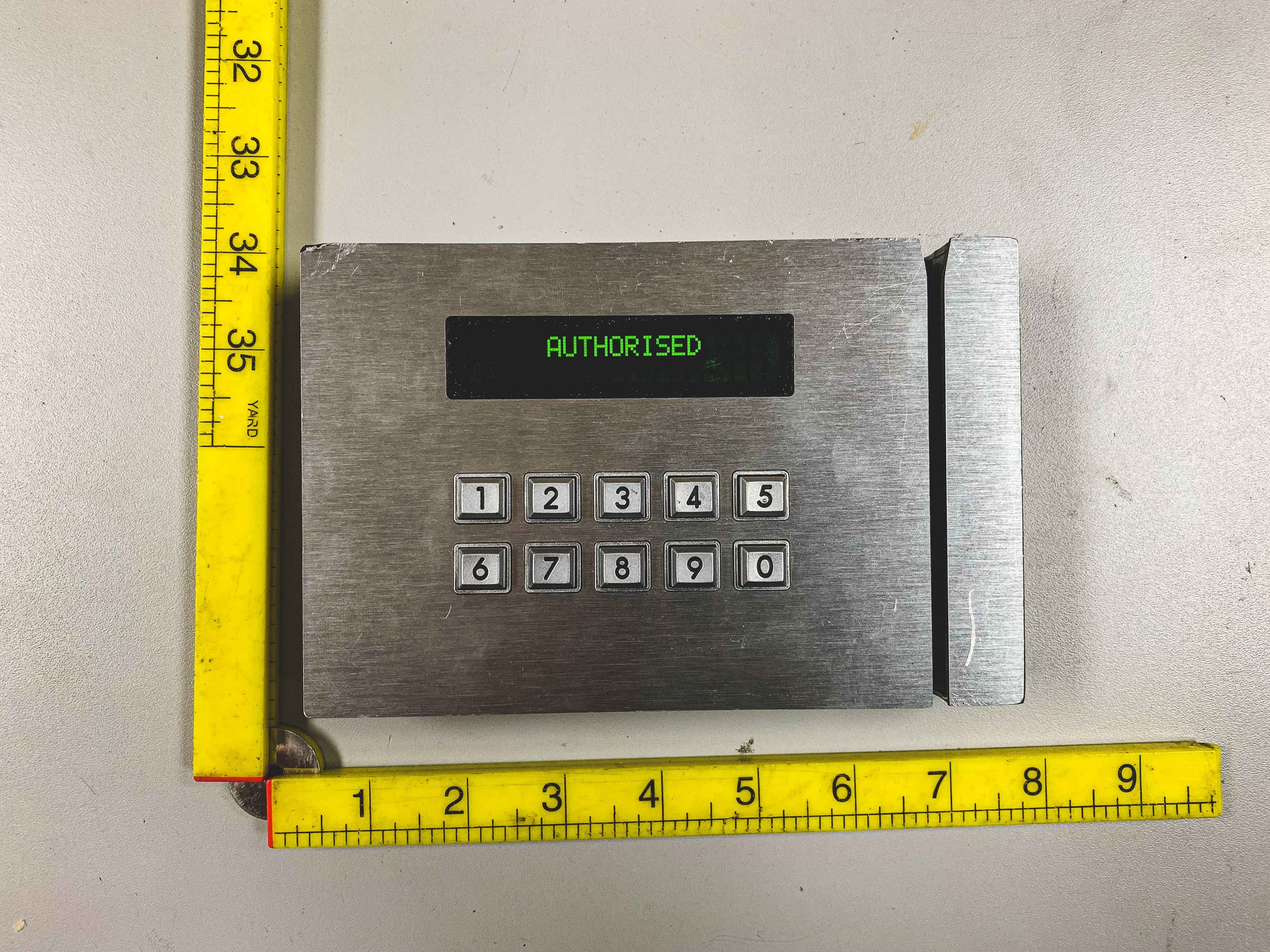 Practical modern looking card swipe entry panel with keypad and green ...