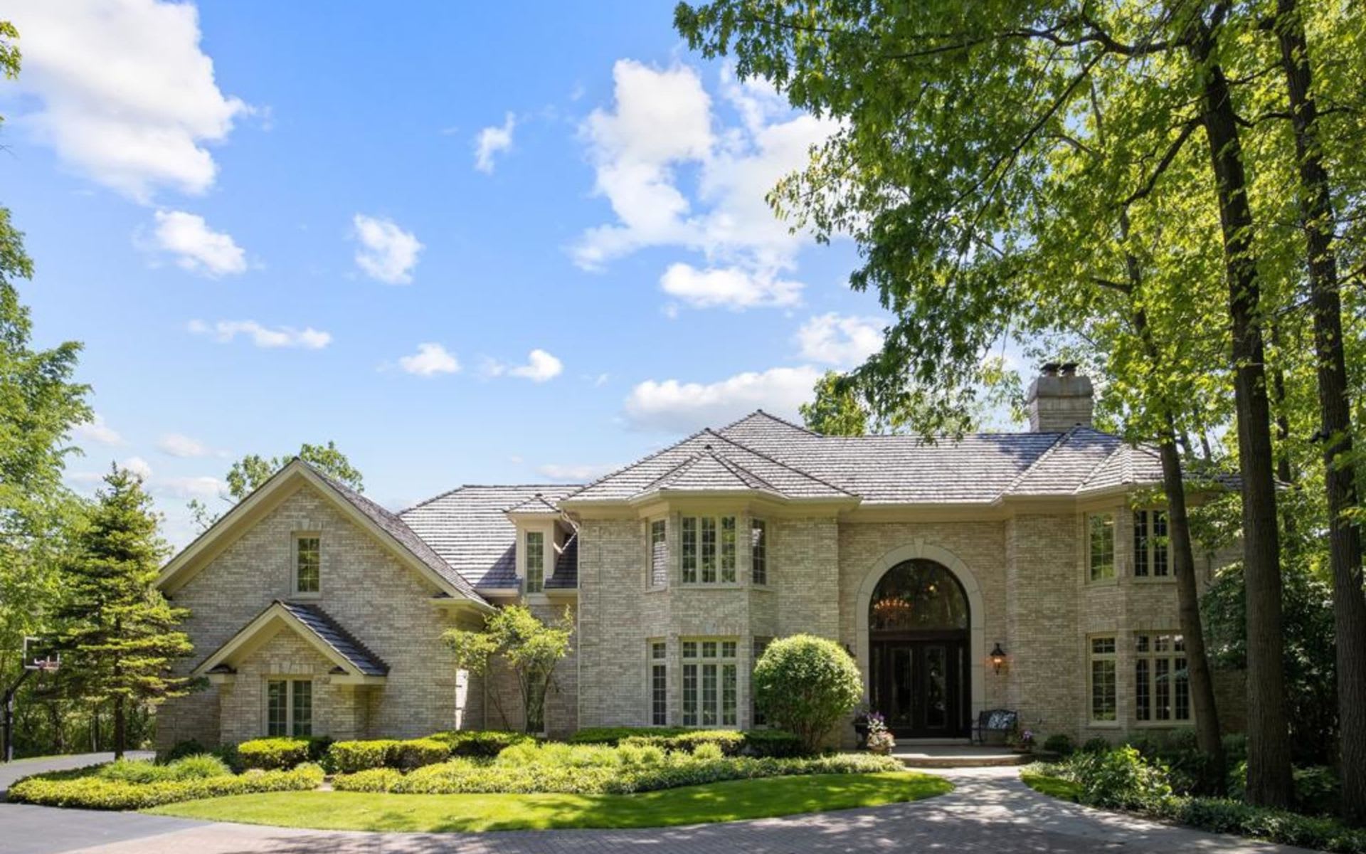 This Stately Brick Traditional Home Is Uniquely Positioned On One Of ...