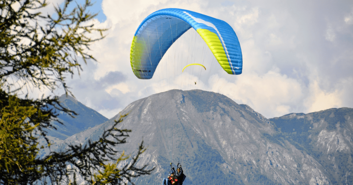 Tandem Paragliding flight over Neustift in Stubai Valley, near ...