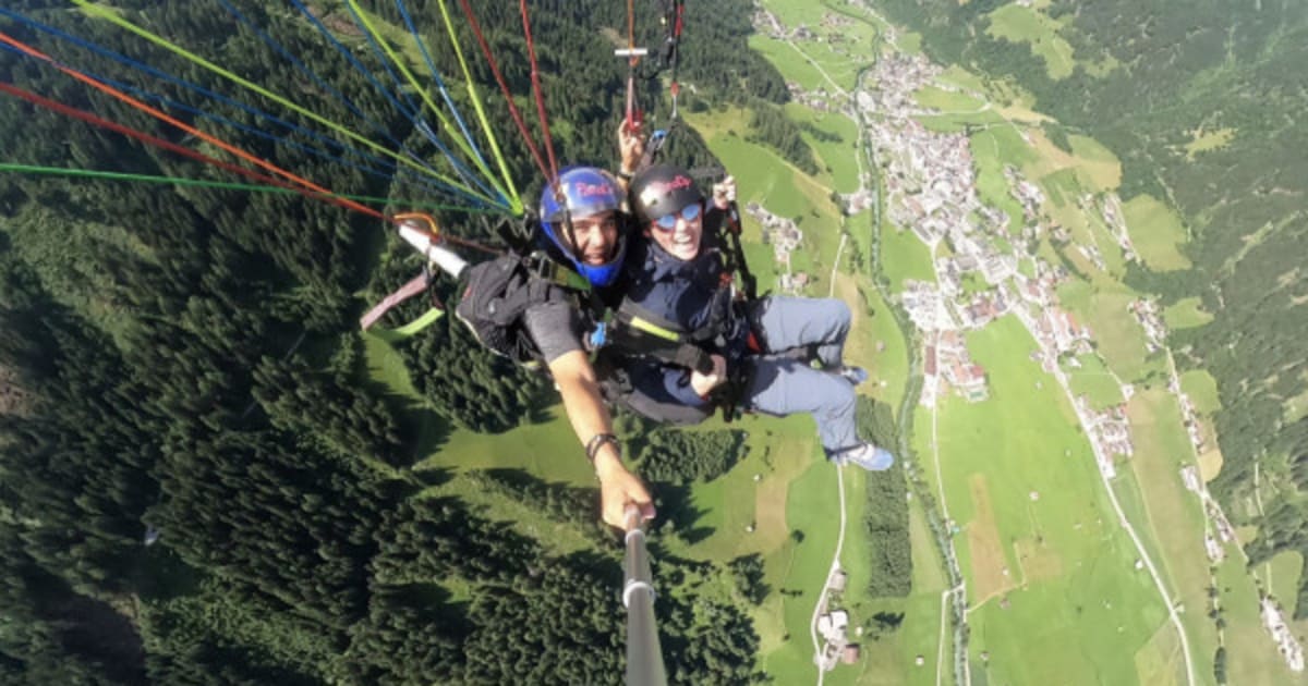 Tandem paragliding flight over the Stubai Valley near Innsbruck ...