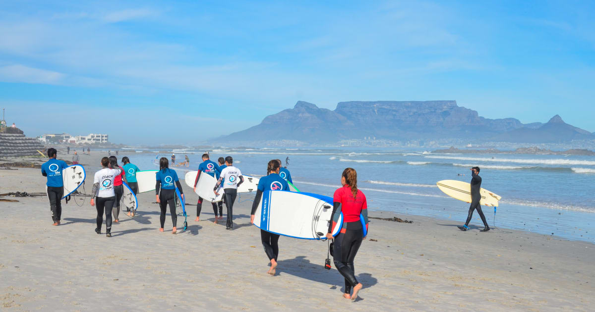Learn how to surf at Big Bay Beach, Cape Town | Manawa