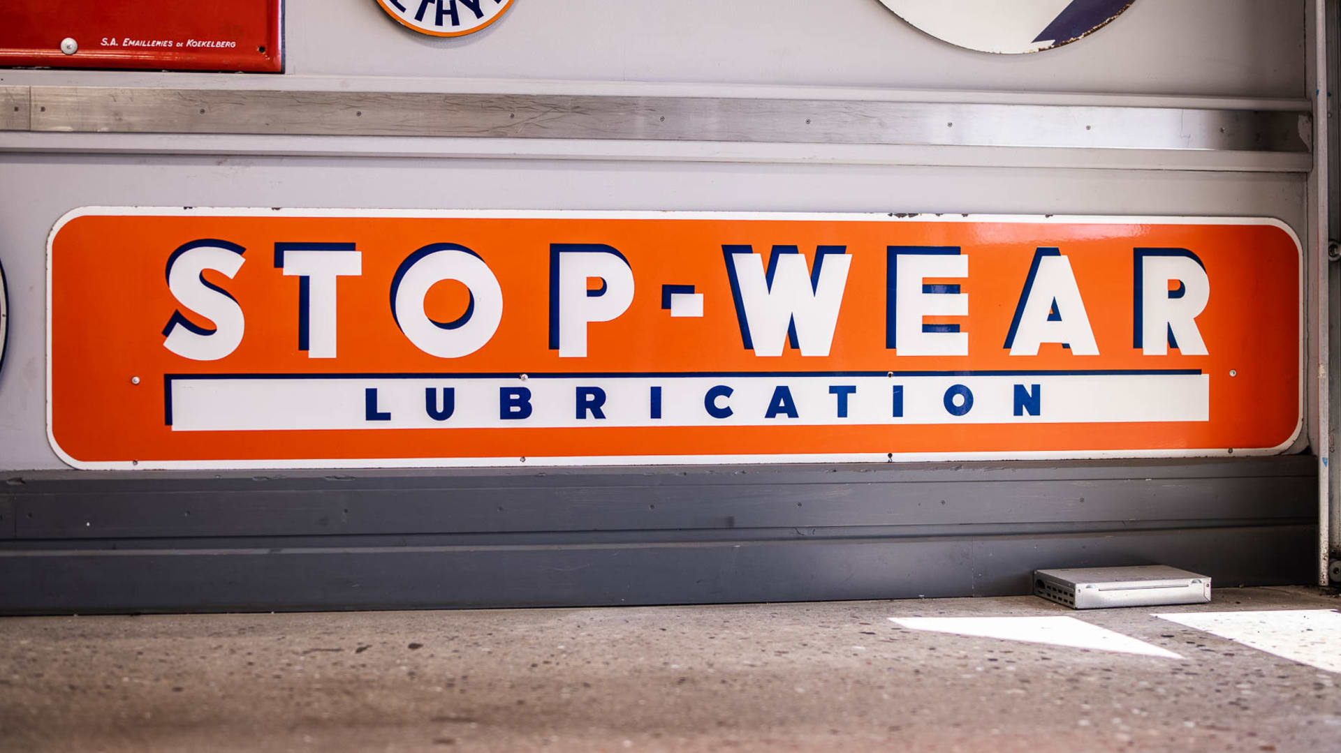Stop-Wear Lubrication Porcelain Sign at The World’s Largest Road Art ...