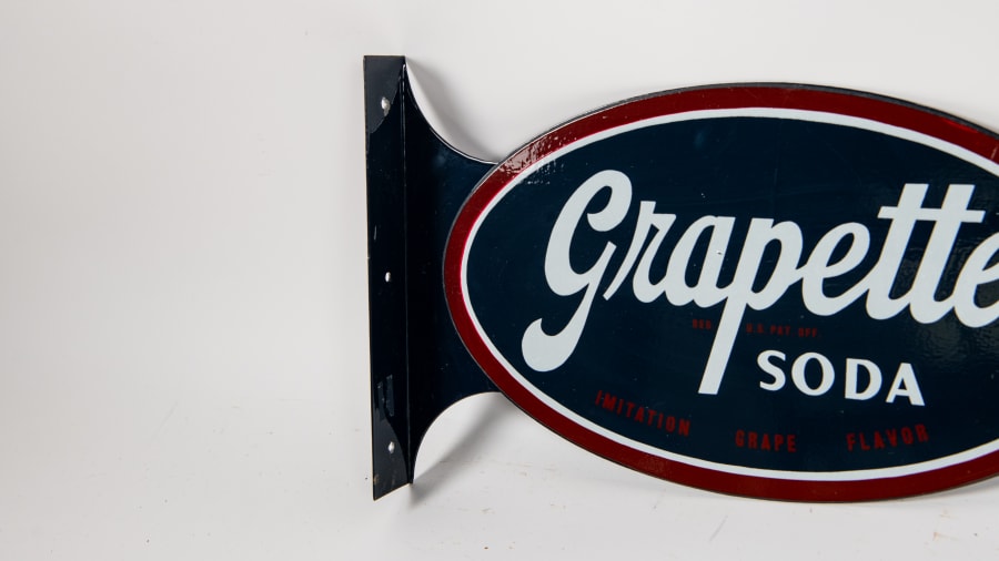 Grapette Soda Porcelain Flange Sign at Dallas 2023 as Z108 - Mecum Auctions