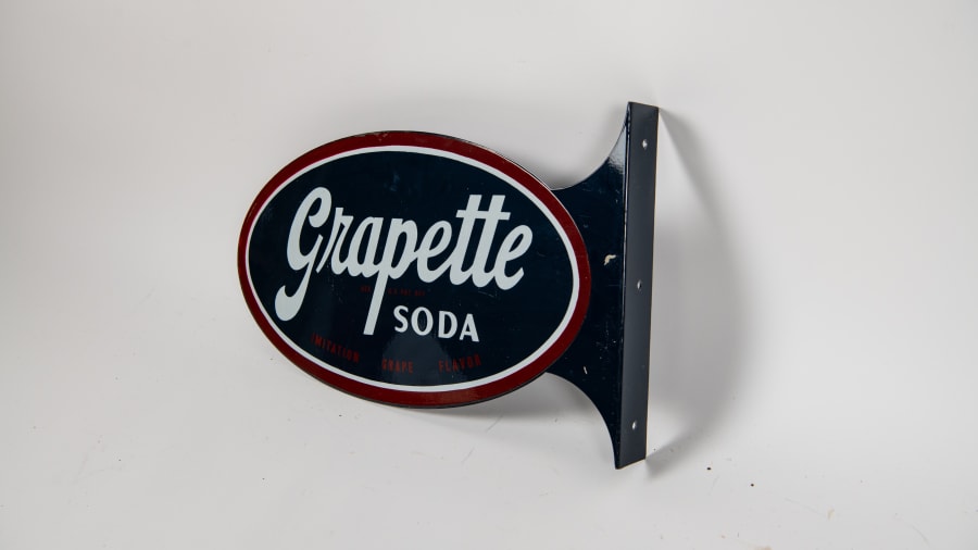 Grapette Soda Porcelain Flange Sign at Dallas 2023 as Z108 - Mecum Auctions