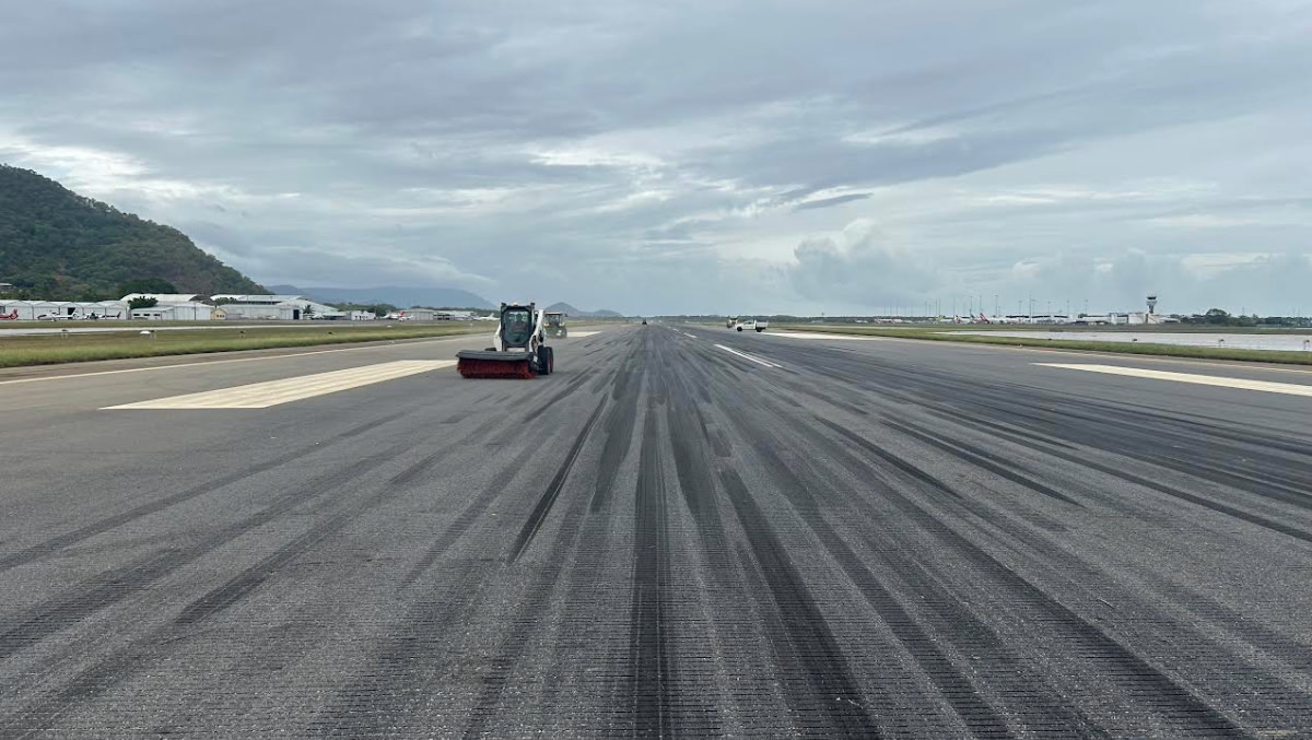 Flights resume from Cairns as runway cleared of flood debris ...