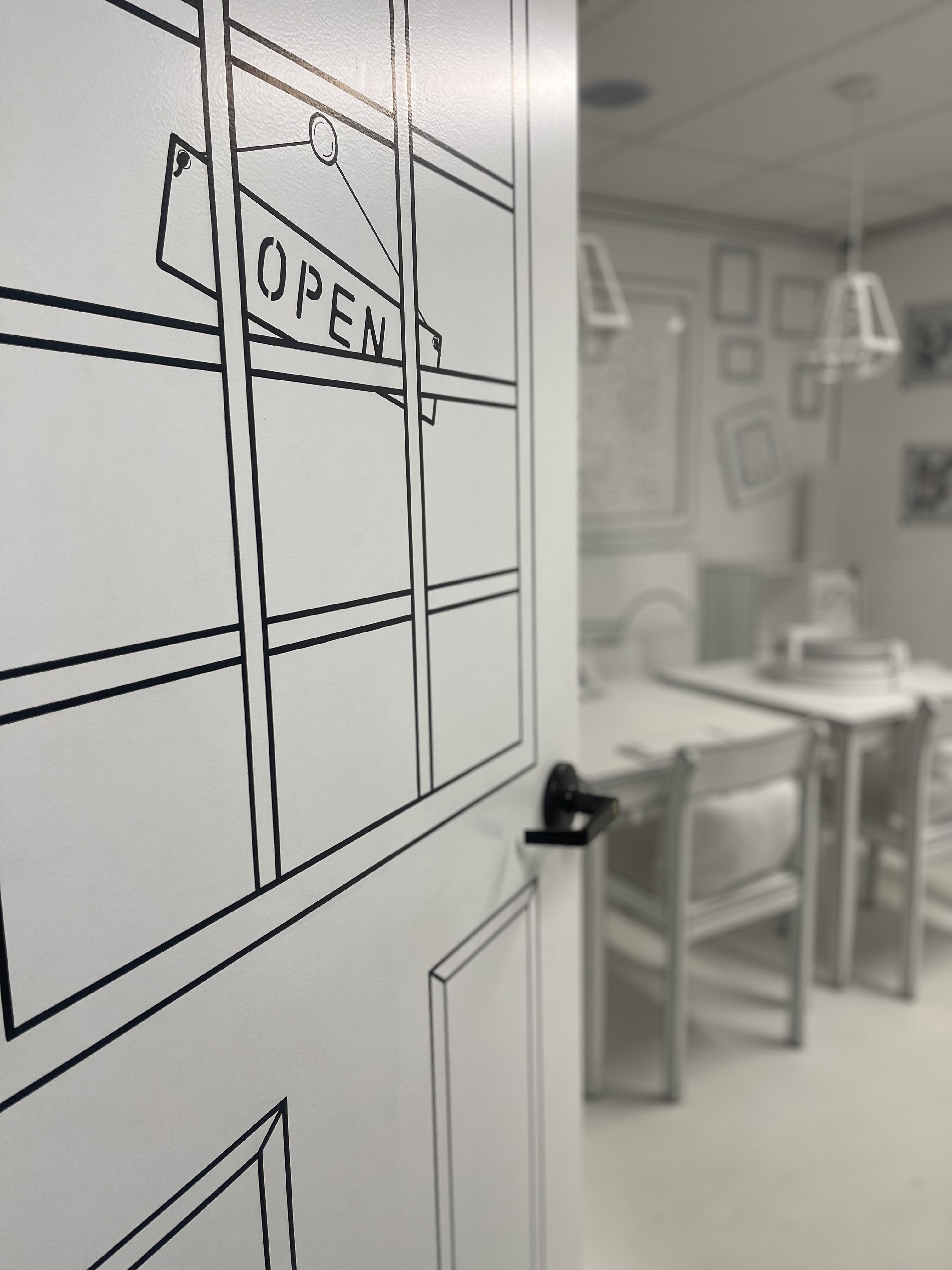 Black and White Cafe Escape Room | MindFox Escape