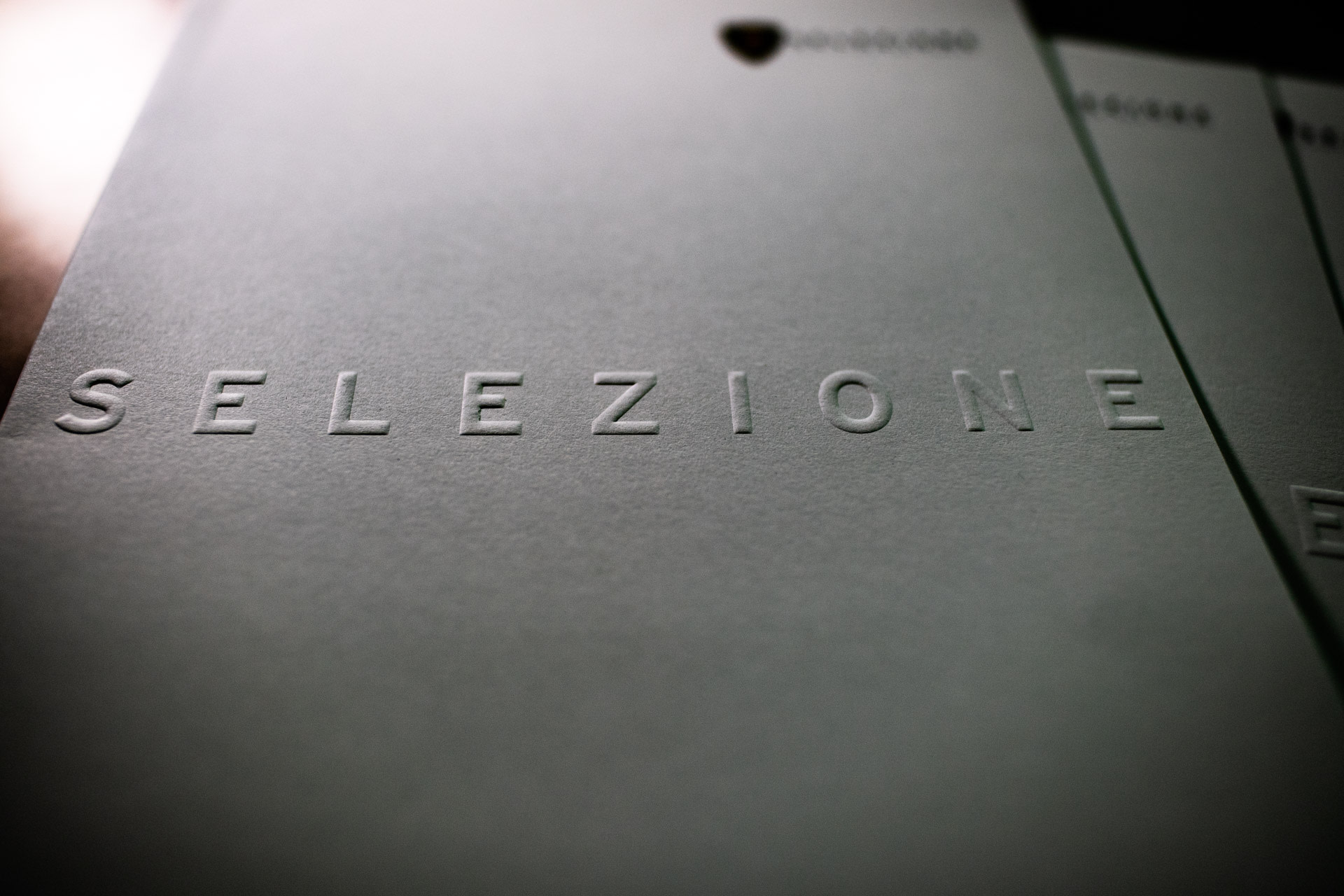 The word Selezione embossed on a leaflet
