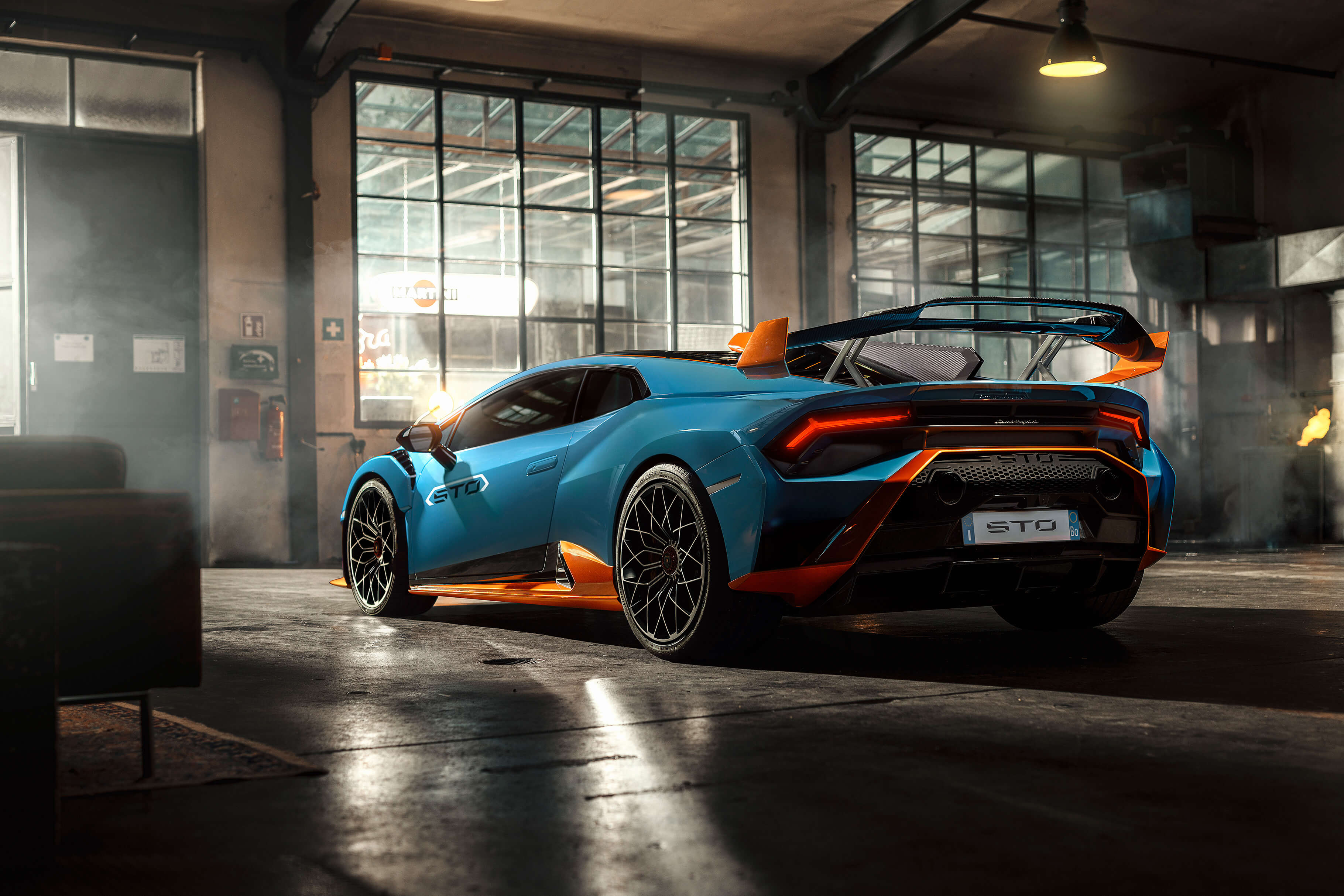 Lamborghini Huracán STO driving at high speed on a track with motion ...