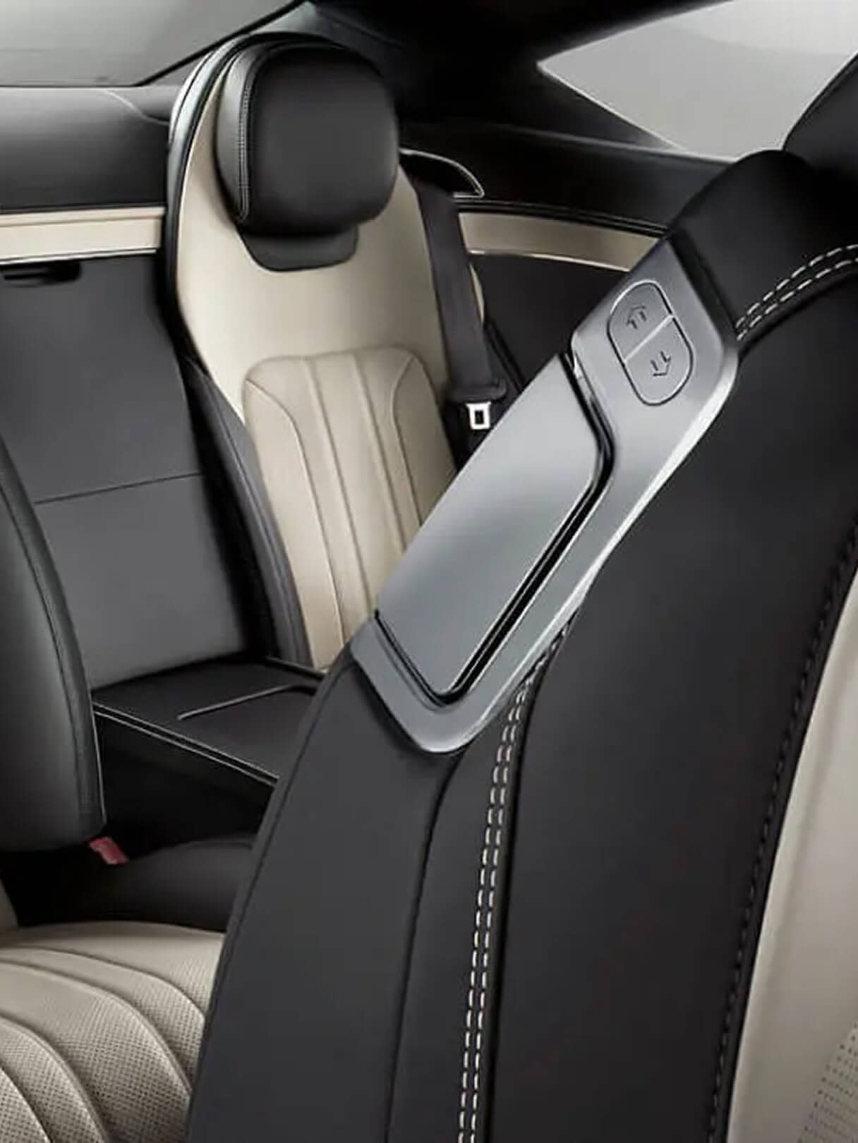 Rear seat detail of a Bentley with luxurious leather upholstery and ...
