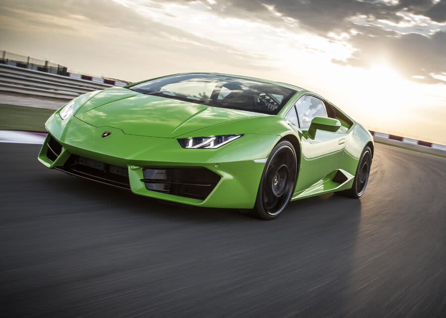 Side view of a Lamborghini Huracán RWD parked in an urban industrial ...