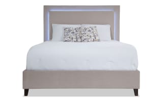 Performa Queen Beige Upholstered Panel Bed | Bob's Discount Furniture ...