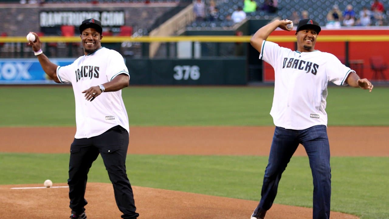 Floyd and Johnson throw first pitch