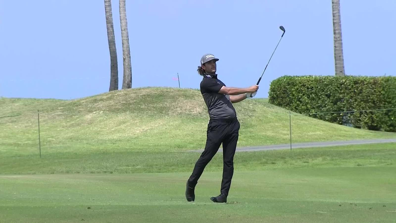 Callum Tarren throws a dart to set up birdie at Puerto Rico