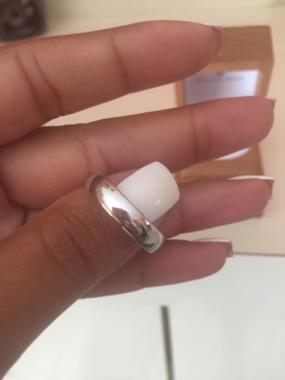 Oval diamond ring on hand