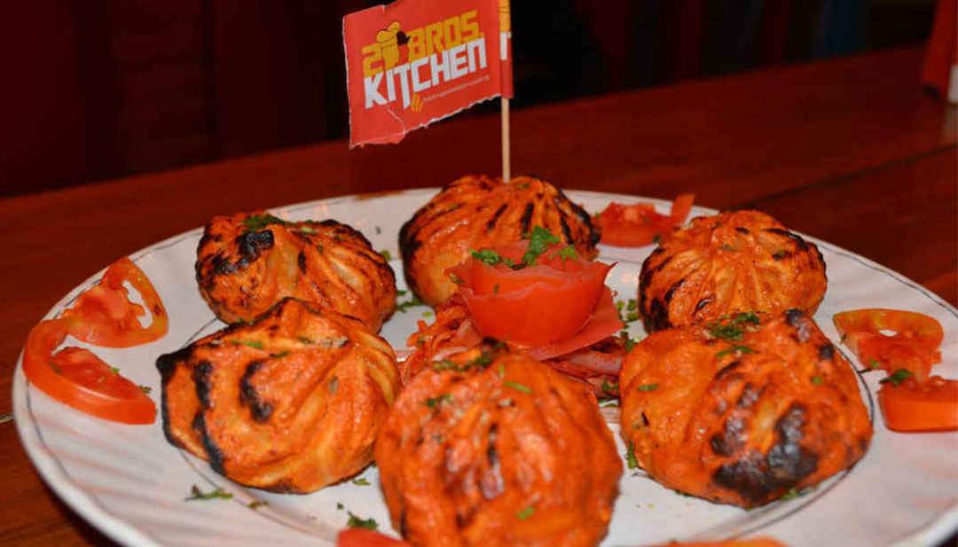 Come Gobble up Butter Chicken Momos @ 2 Bros Kitchen | So Delhi