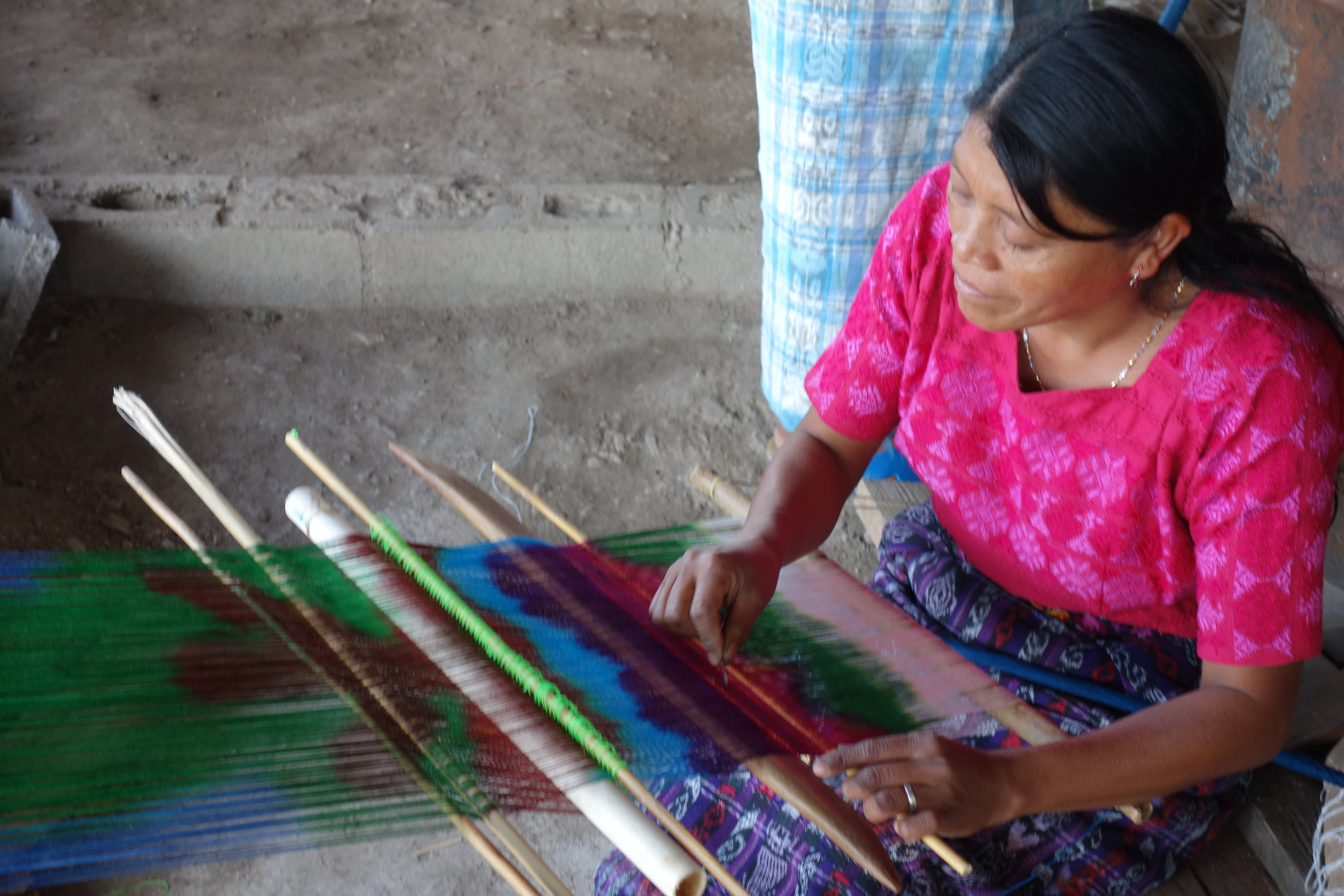 Beginning to weave a painted warp