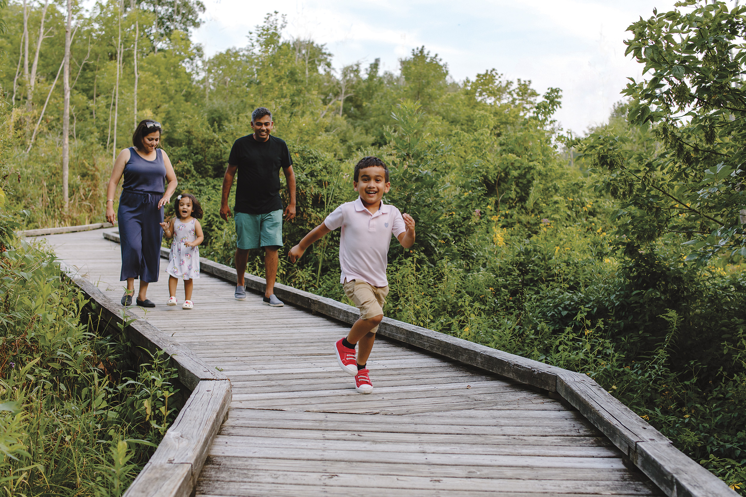 Family Walking In Park