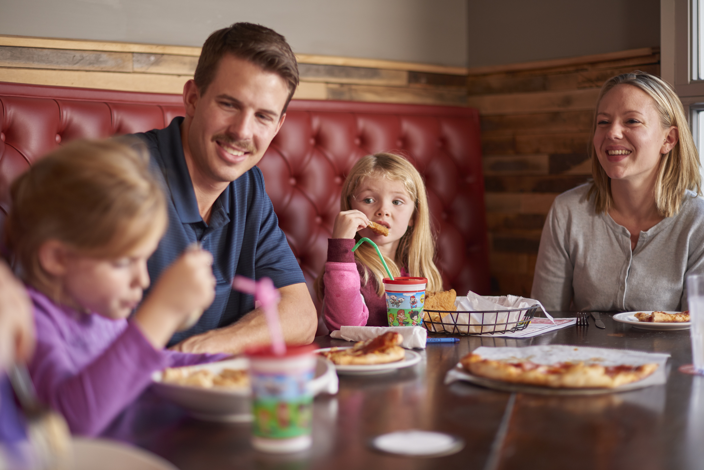 Family Eating At Fast Food Restaurant