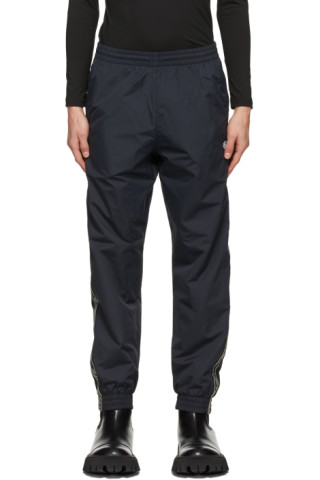 VETEMENTS: Black Logo Tape Track Pants | SSENSE Canada