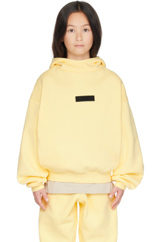 Enfant | Pull à capuche jaune à écussons par Fear of God ESSENTIALS ...