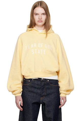 Fear of God ESSENTIALS: Yellow Fleece Raglan Hoodie | SSENSE