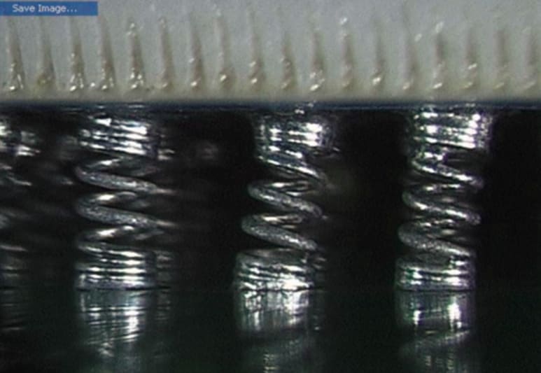 Micro-Coil Spring Interconnection for Ceramic Grid Array Packaged ...