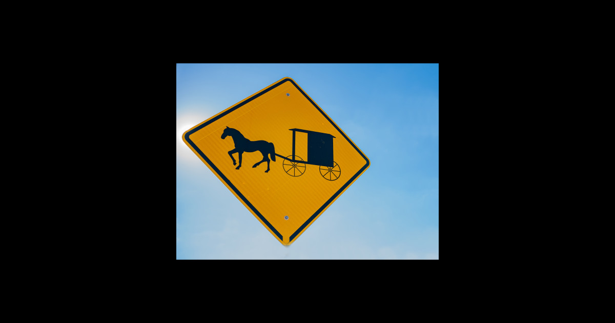 Amish traditional horse and buggy road sign yellow on blue background ...