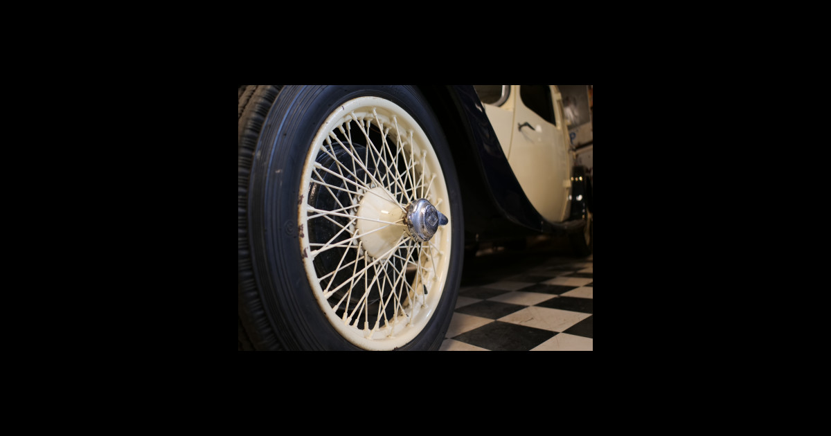 Old spoke wheel of vintage car in cream colour - Tyre - Sticker | TeePublic