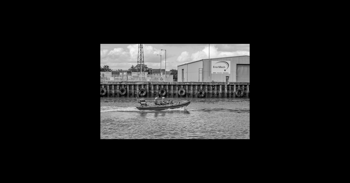 Inshore RNLI lifeboat crew motoring up the River Yare - Lifeboat ...