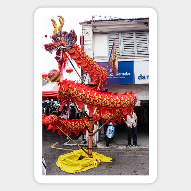 A cruled long red dragon on a Chinese New Year festival on a street in ...