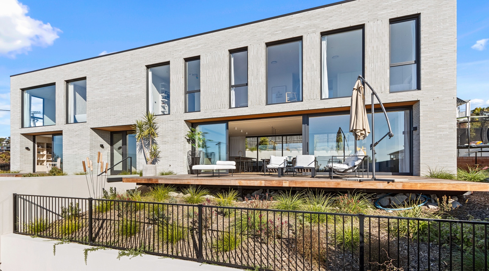 Modern Kiwi Home with Stunning Sea Views & 70s Vibe | Trends