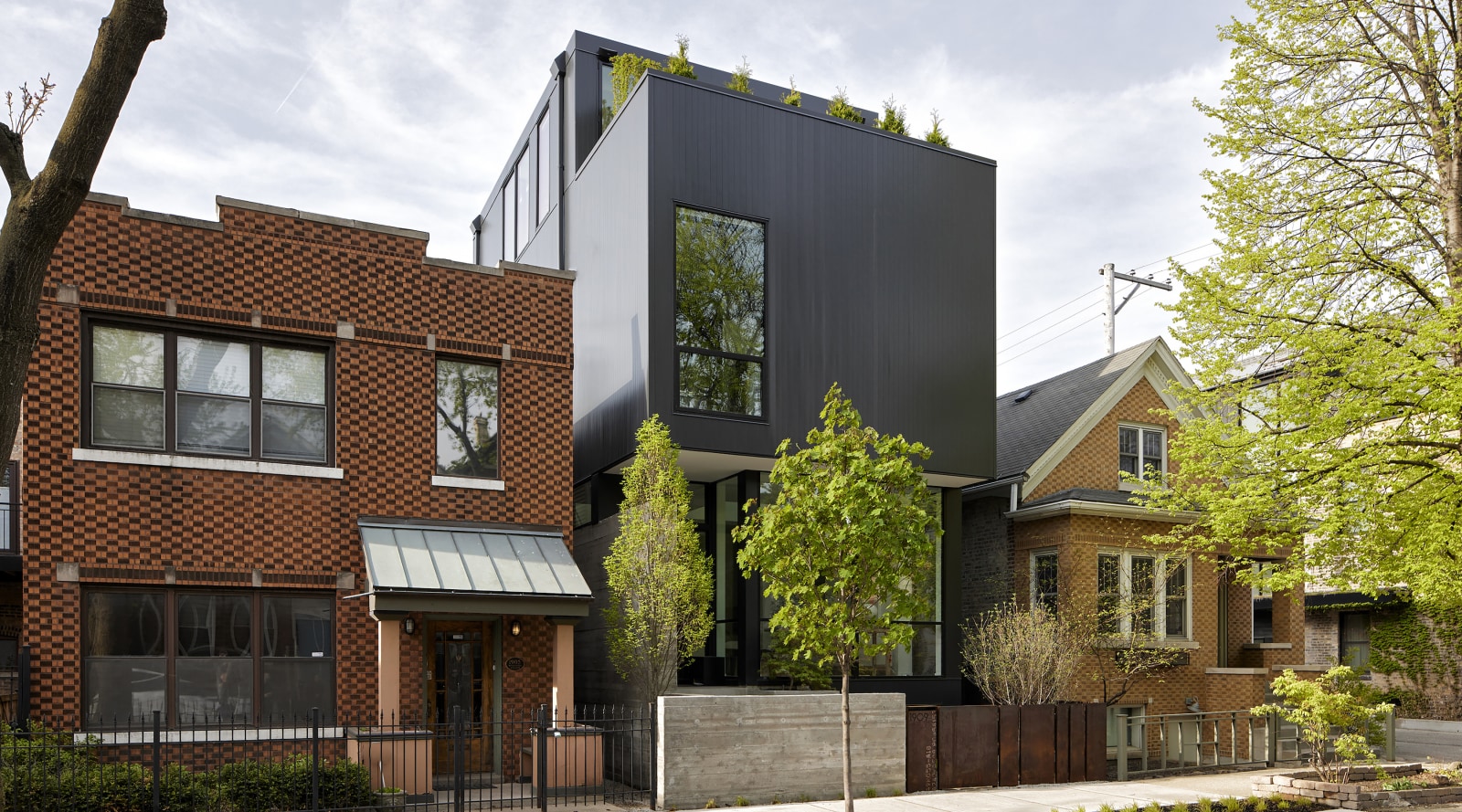 Modern cladding amongst more traditional homes | Trends