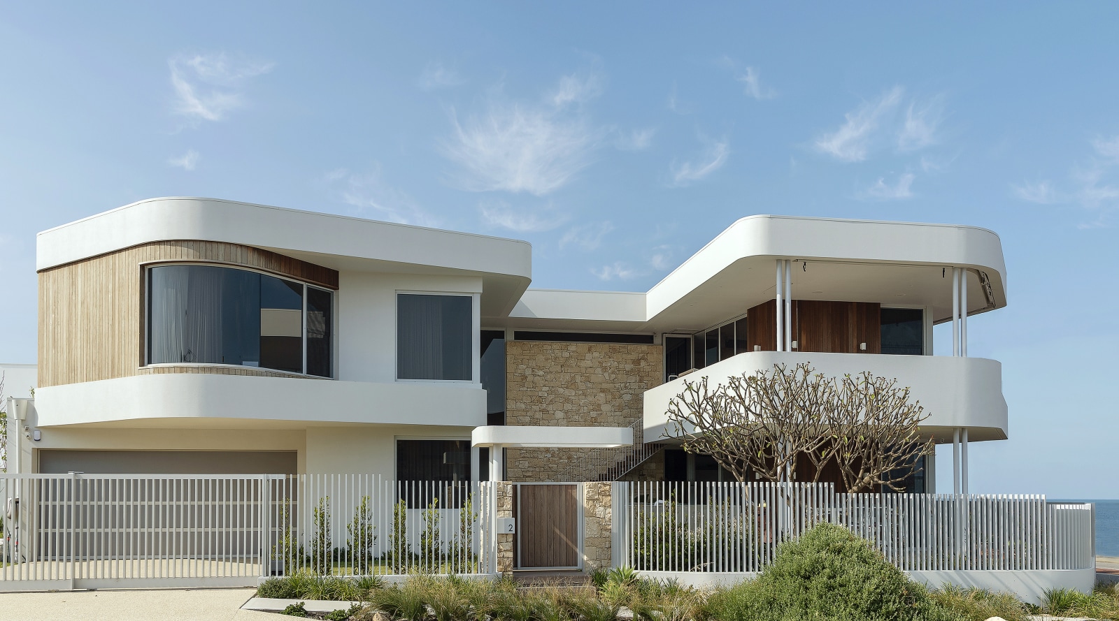 Rounded coastal home with glass-sided pool | Trends