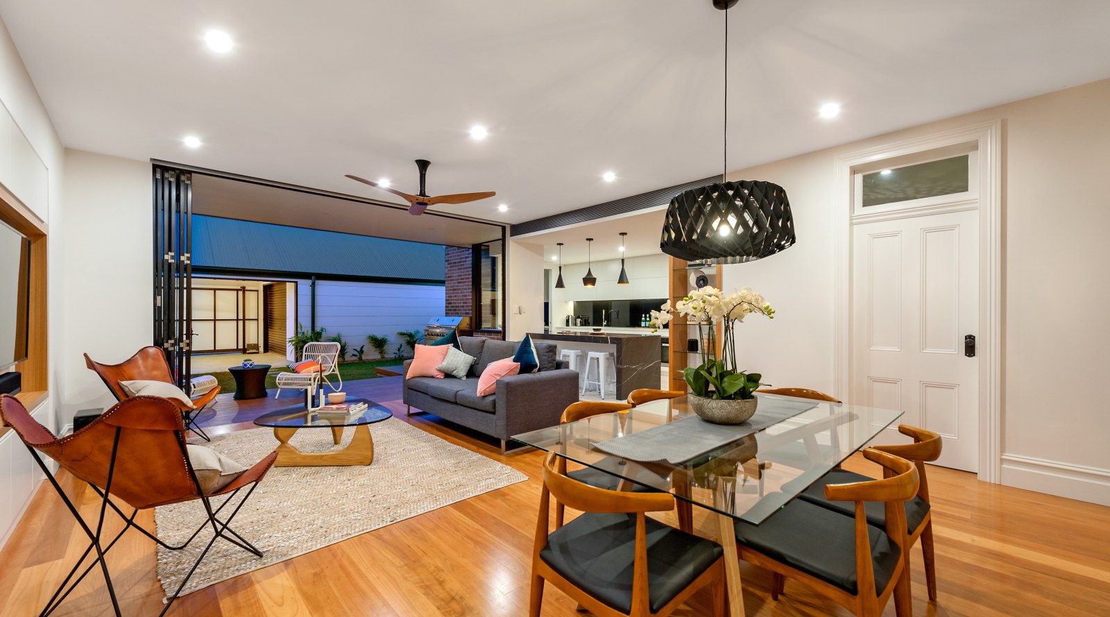 Wide bi-folds open up the interior of this… | Trends