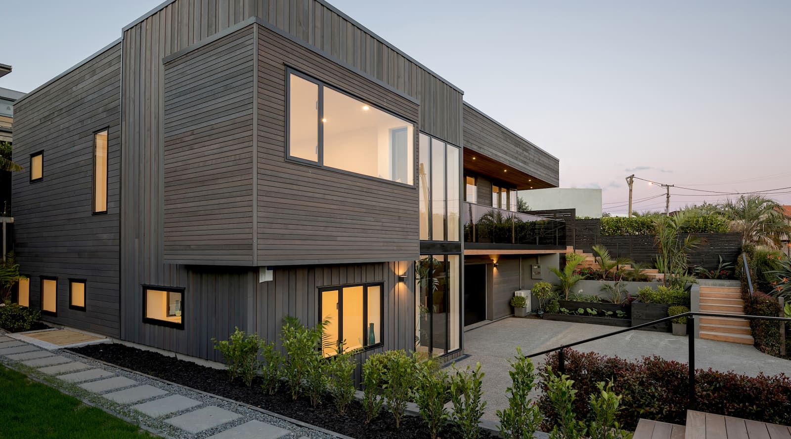 Slatted timber cladding gives this home a new… | Trends