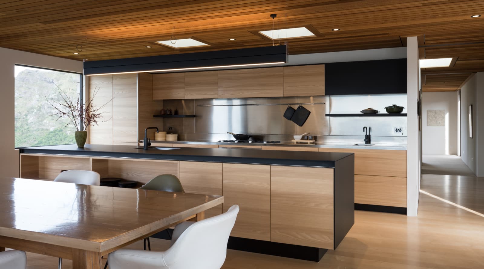 Sleek new kitchen has clean lined design and an… | Trends