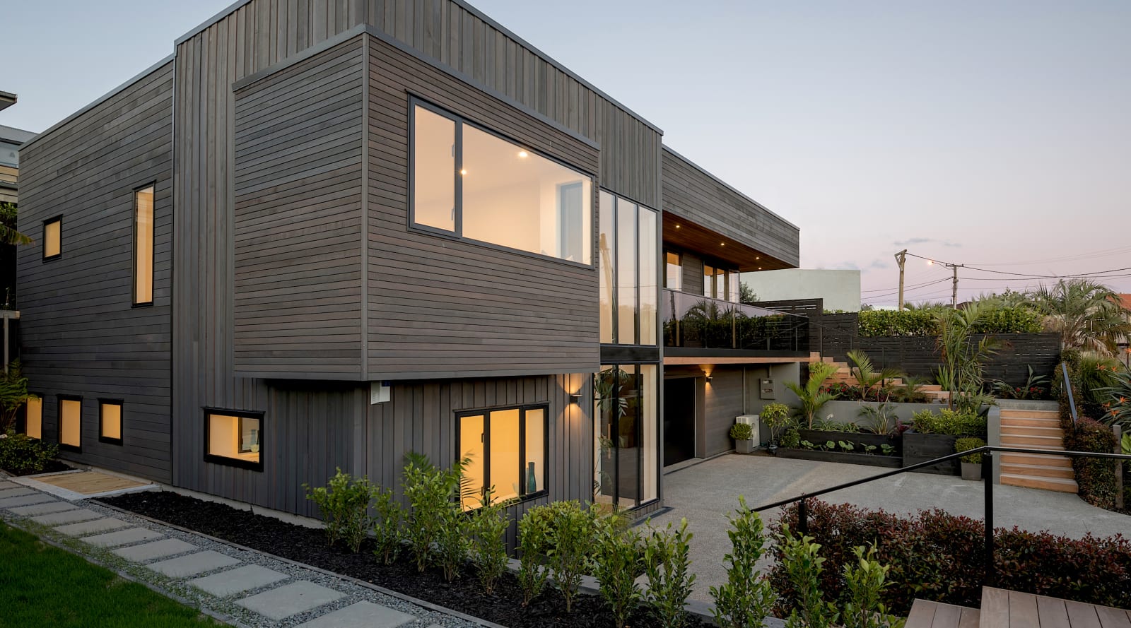 Slatted timber cladding gives this home a new… | Trends