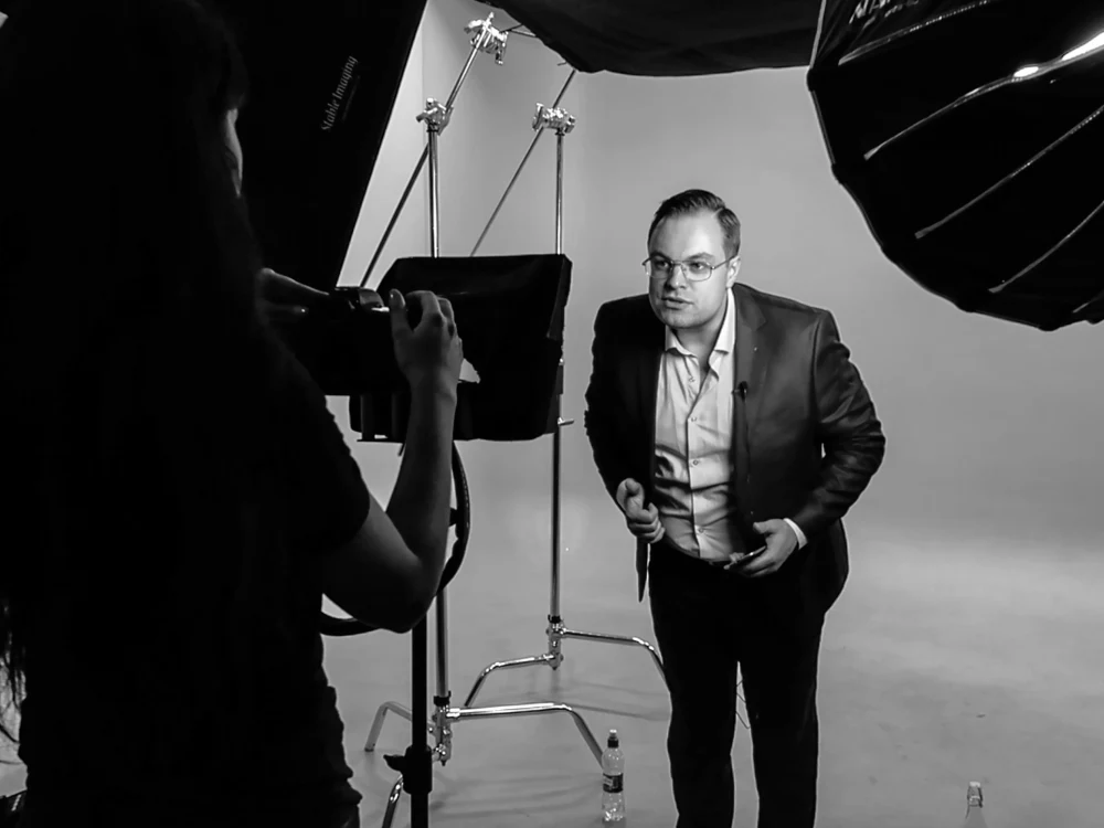 A professional talking head video inside a studio with an American ...